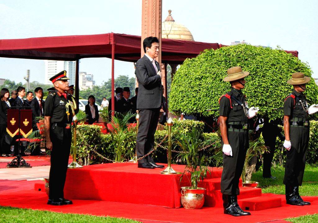 Japanese Minister of Defence Minoru Kihara inspects the guard of honour
