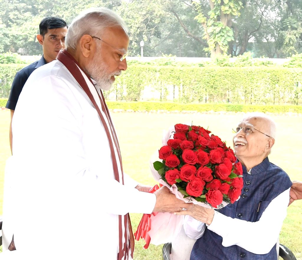 New Delhi : PM Narendra Modi with Lal Krishna Advani on his birthday