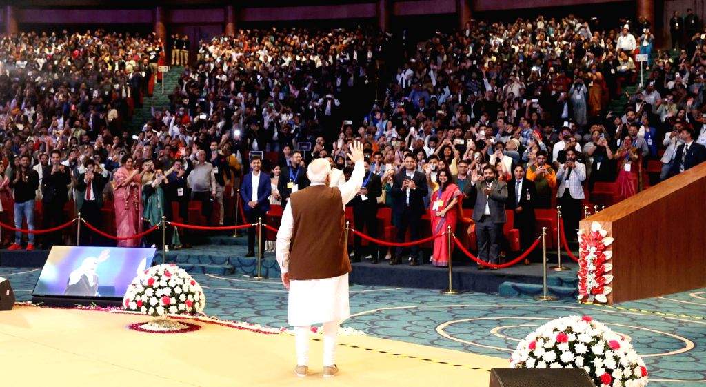 Prime Minister Narendra Modi waves at gathering during the National ...