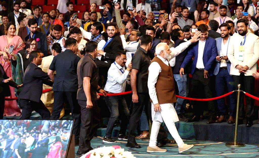 Prime Minister Narendra Modi waves at gathering during the National ...