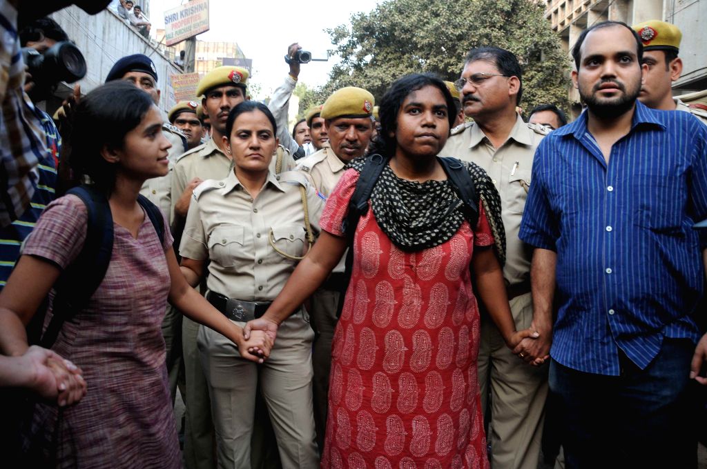 Supporters of 'Kiss of Love' protest near RSS office