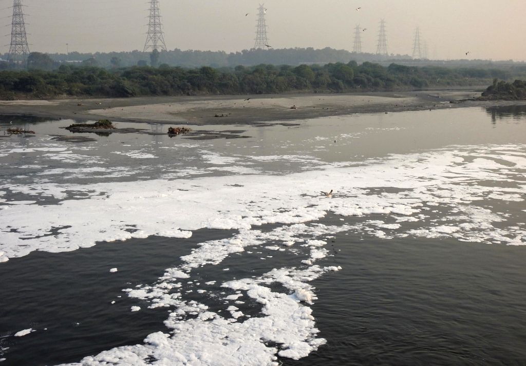 : New Delhi : Toxic foam floats in the river Yamuna at ITO Chhat Ghat ...