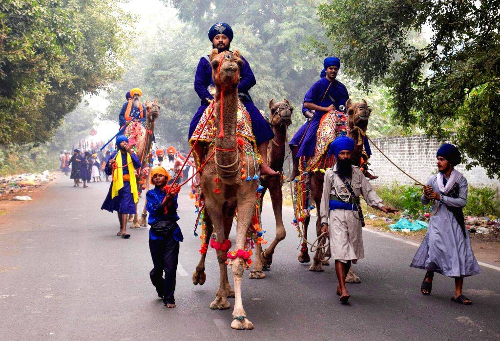 Nihang or Sikh warriors arrive to take part in the Fateh Diwas celebrations