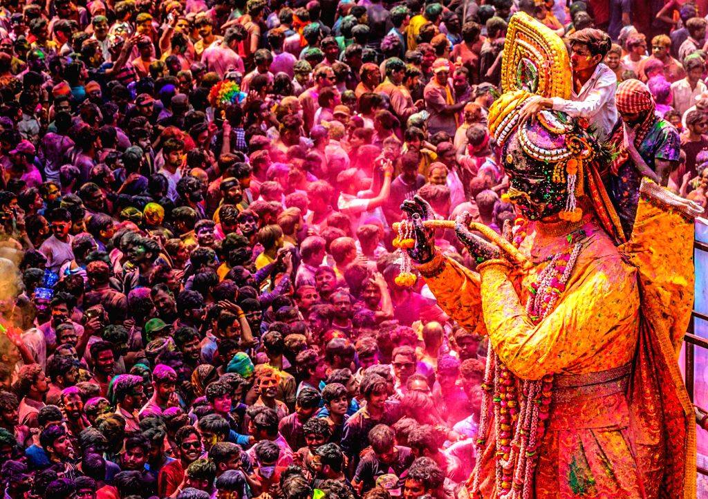 People play with colours as they celebrate Holi in Orchha