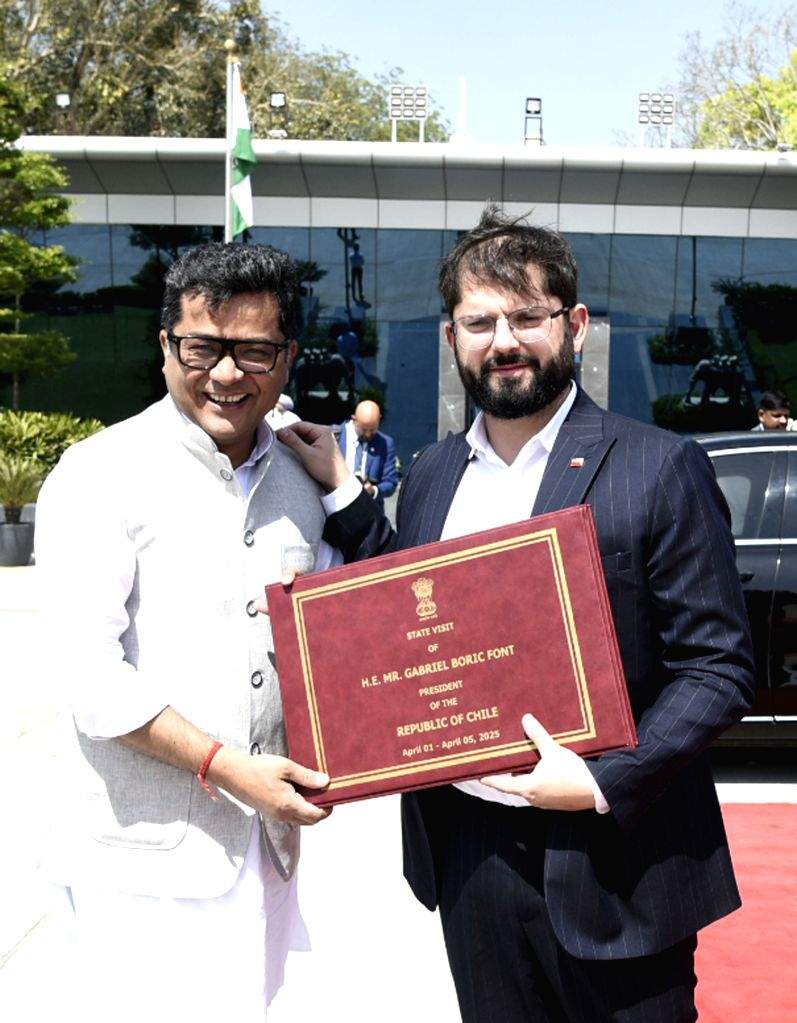 Pabitra Margherita presents a photo album to the President of the ...