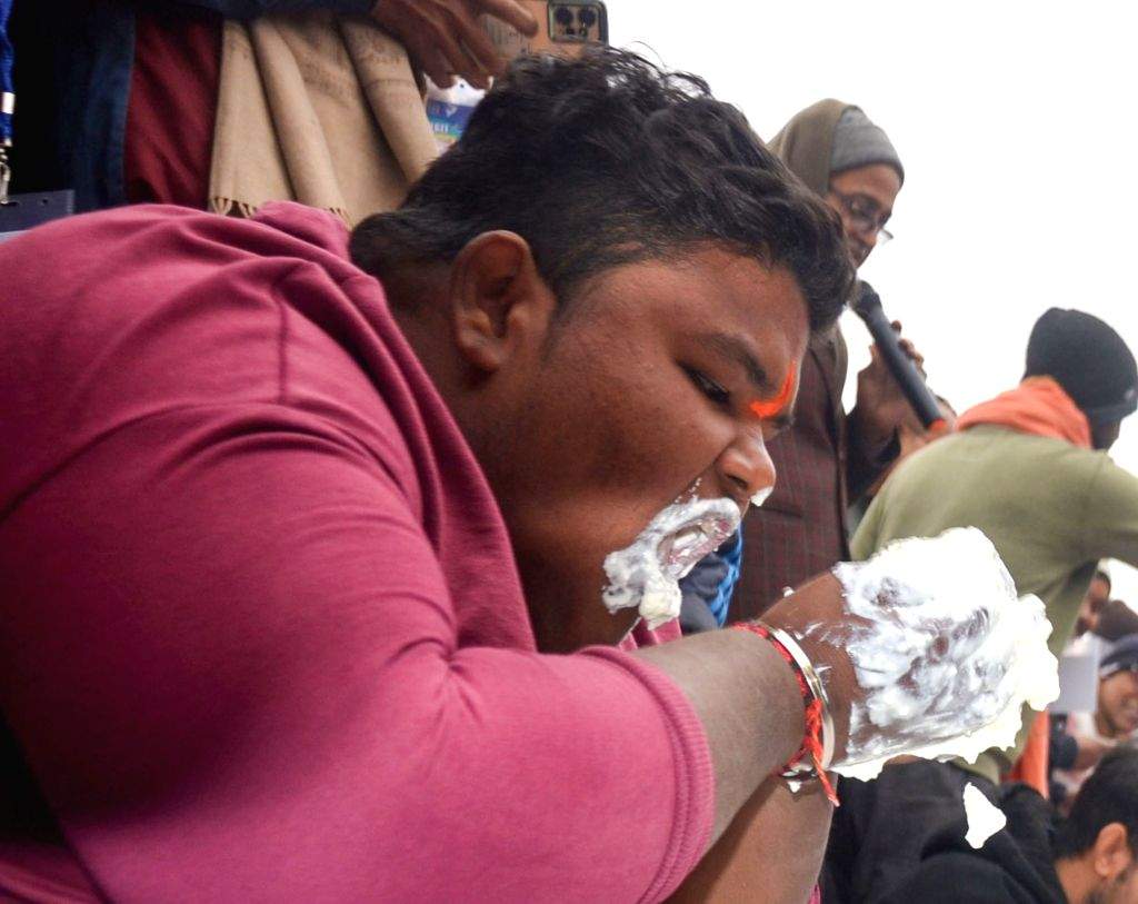 Participants during "Dahi Khao"curd eating competition