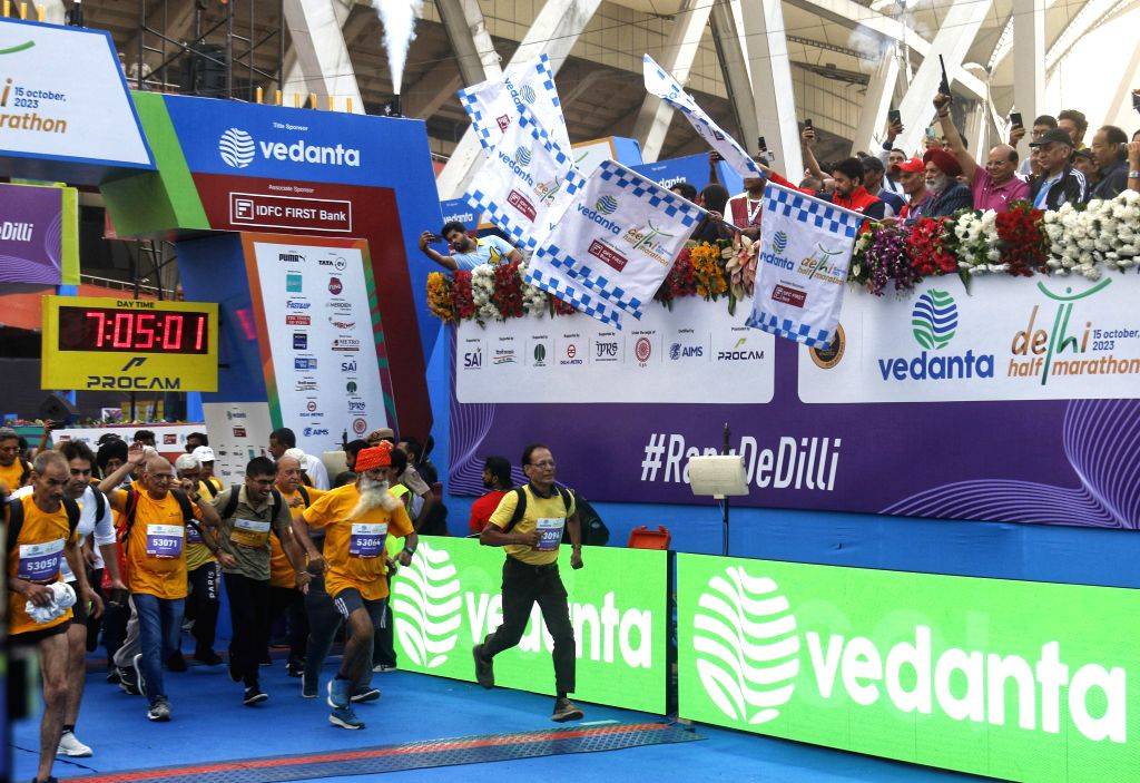 Participants during the Vedanta Delhi Half Marathon 2023, at Jawaharlal ...