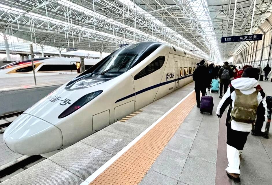 Beijing : Passengers take a train at Beijing North Railway Station in ...