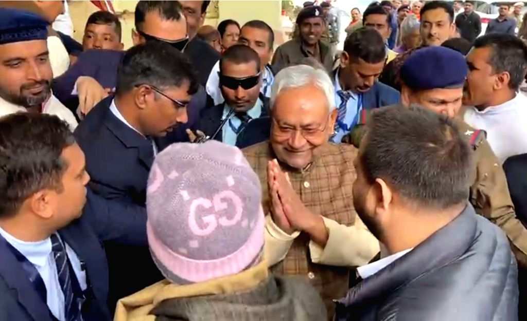 Bihar Chief Minister Nitish Kumar greets RJD leaders Lalu Yadav and ...