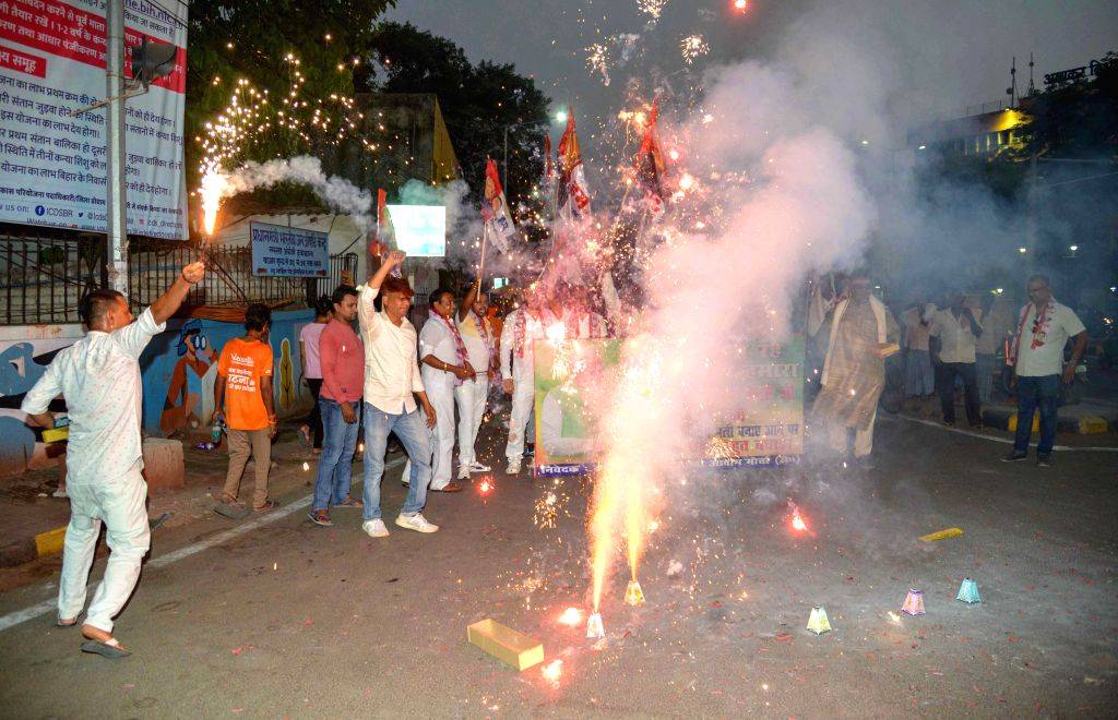 Patna : Hindustani Awam Morcha supporters burst crackers during the ...