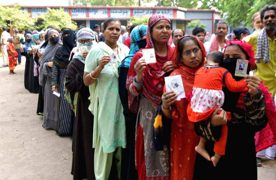 People cast their votes in the seventh and final phase of the Lok Sabha ...