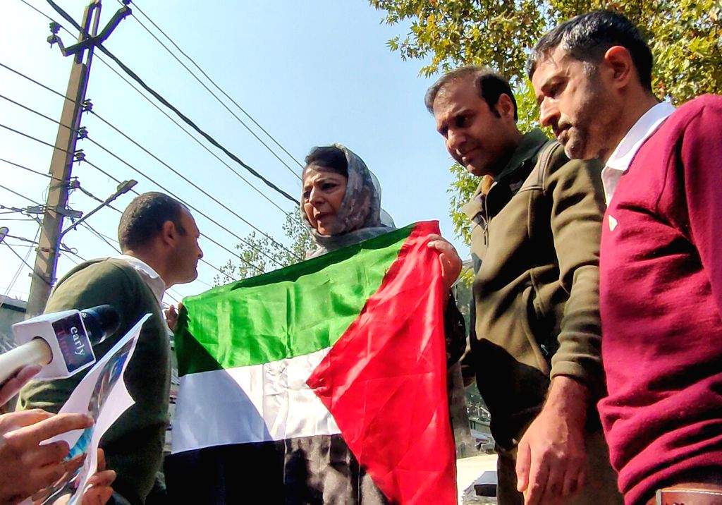 PDP chief Mehbooba Mufti, holding a Palestinian flag, leads a pro ...