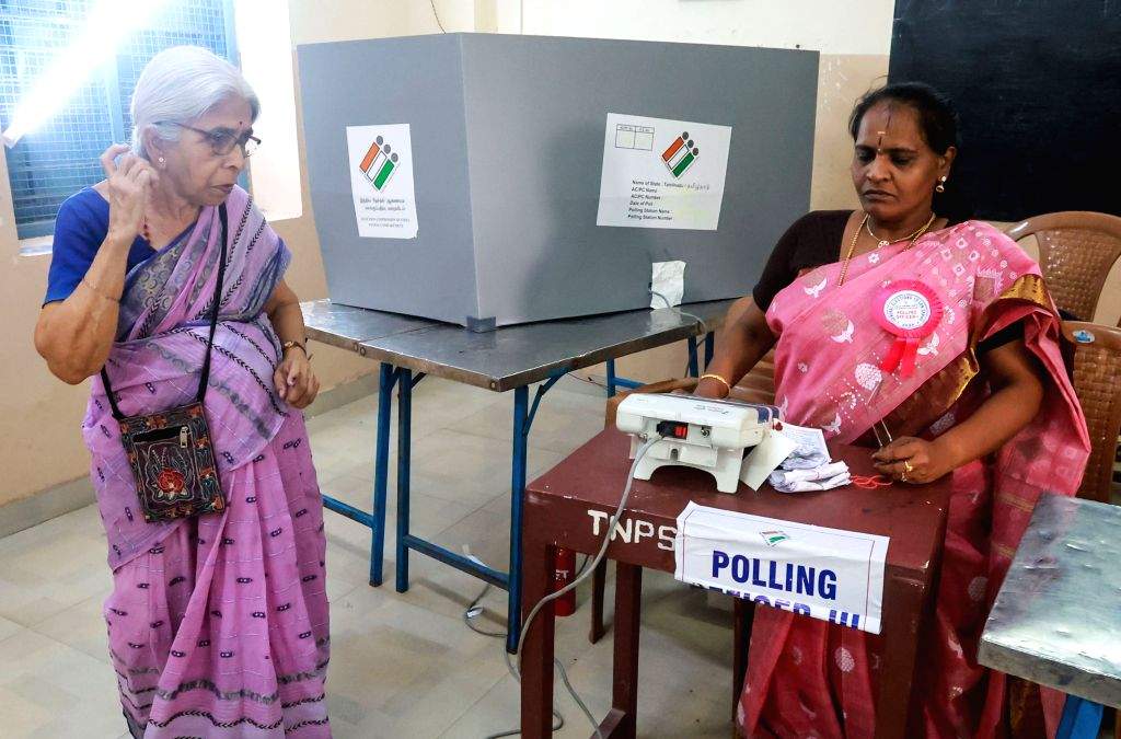 People arrive to cast their votes for the first phase of the Lok Sabha ...