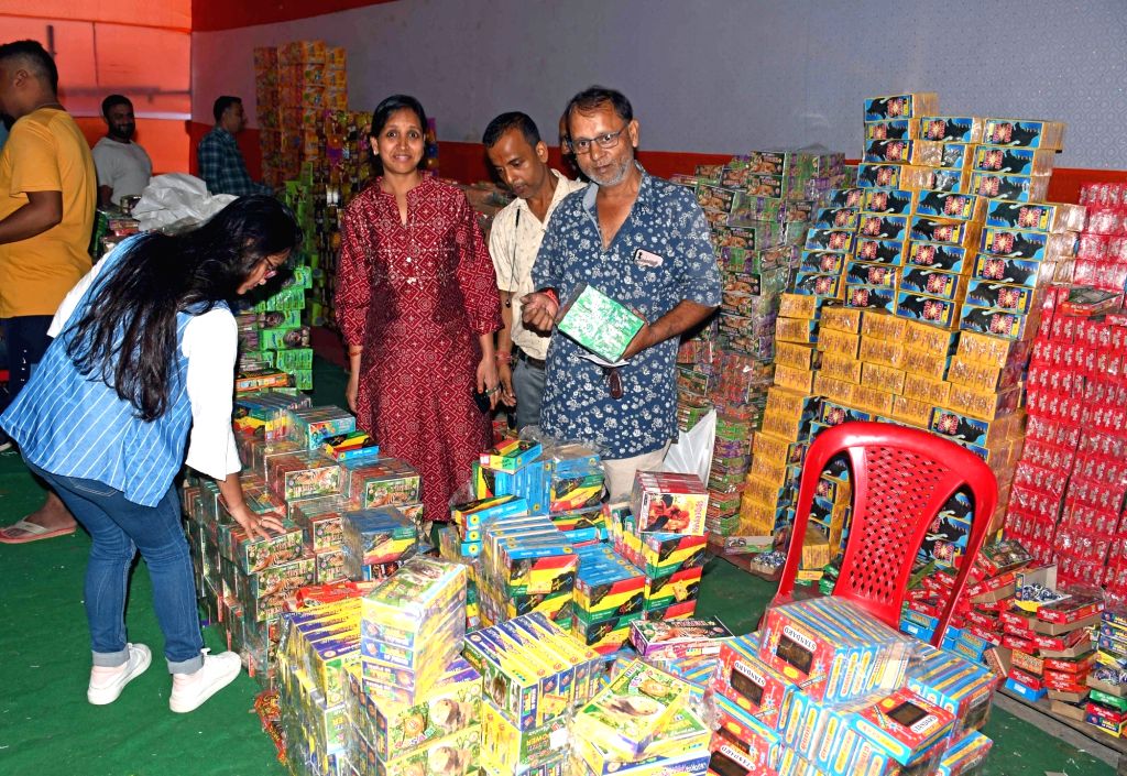 People buy firecrackers on the occasion of Diwali festival