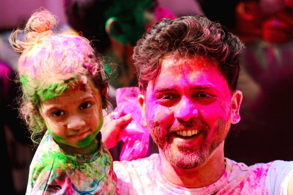 People Celebrate Holi with Colours
