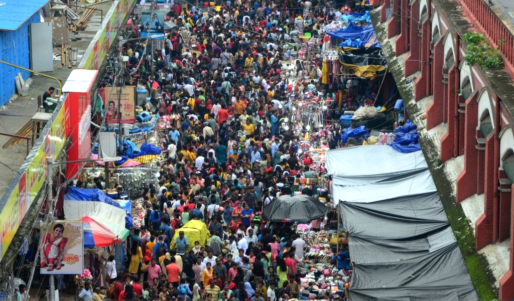 People crowd seen for Puja shopping at New Market area ahead of the ...