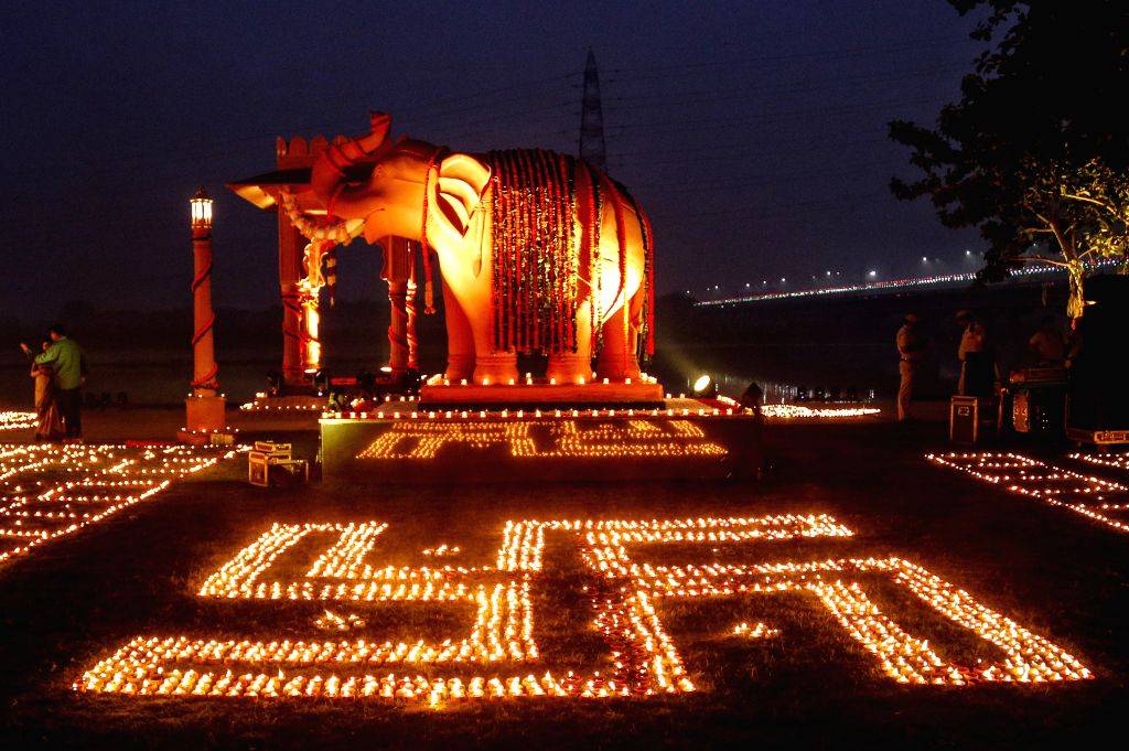 People light earthen lamps at Vasudev Ghat near Kashmiri Gate during ...
