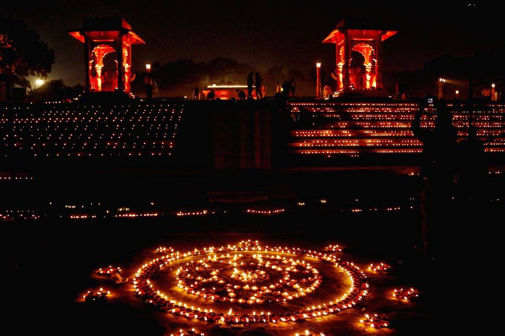 People light earthen lamps at Vasudev Ghat near Kashmiri Gate during ...