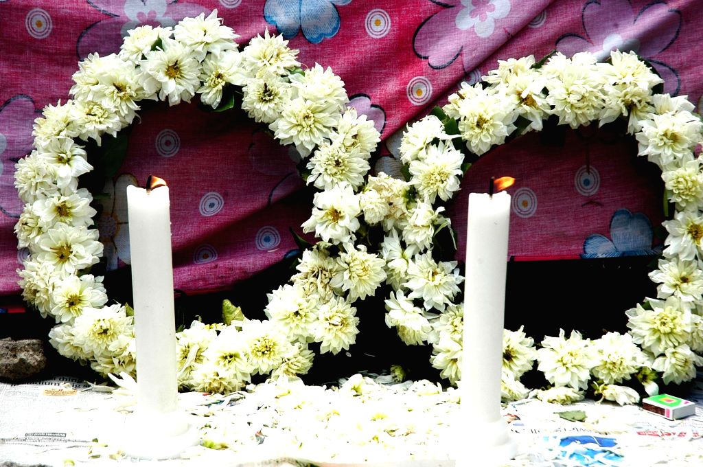 People pay tribute to the people killed in Vivekananda flyover collapse