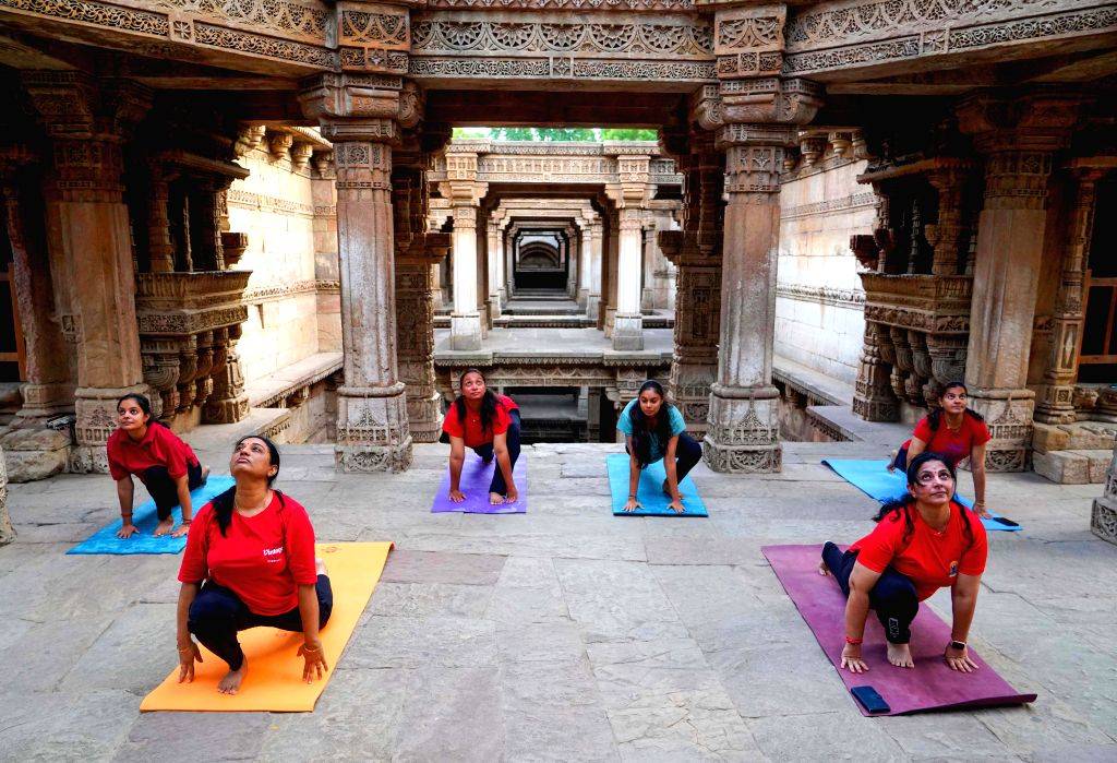 People perform Yoga on the occasion of International Day of Yoga at ...