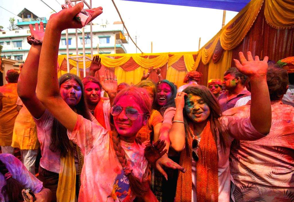 People play with colours during Holi celebrations