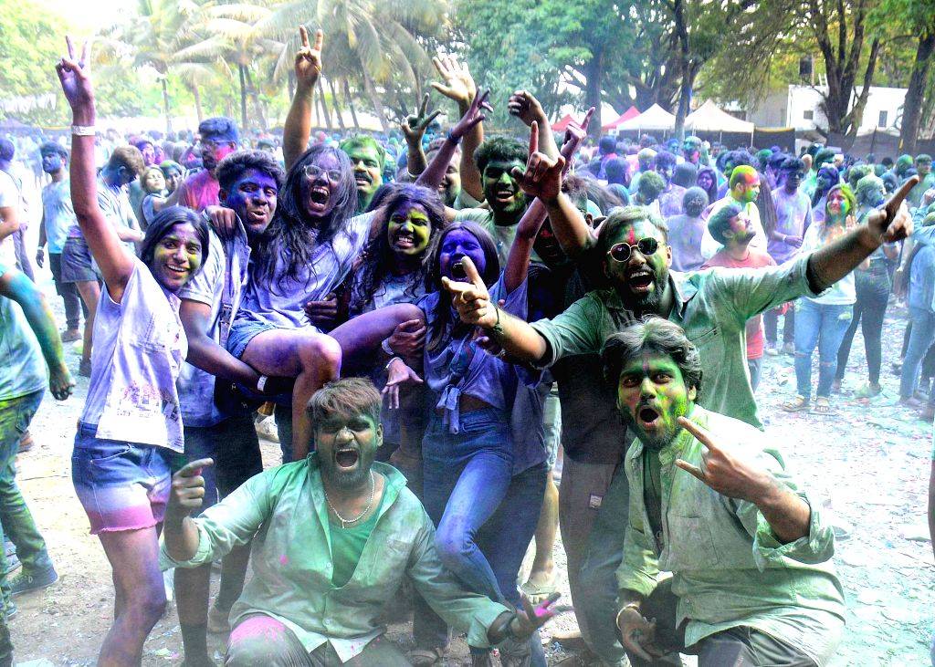 People play with colours during Holi celebrations