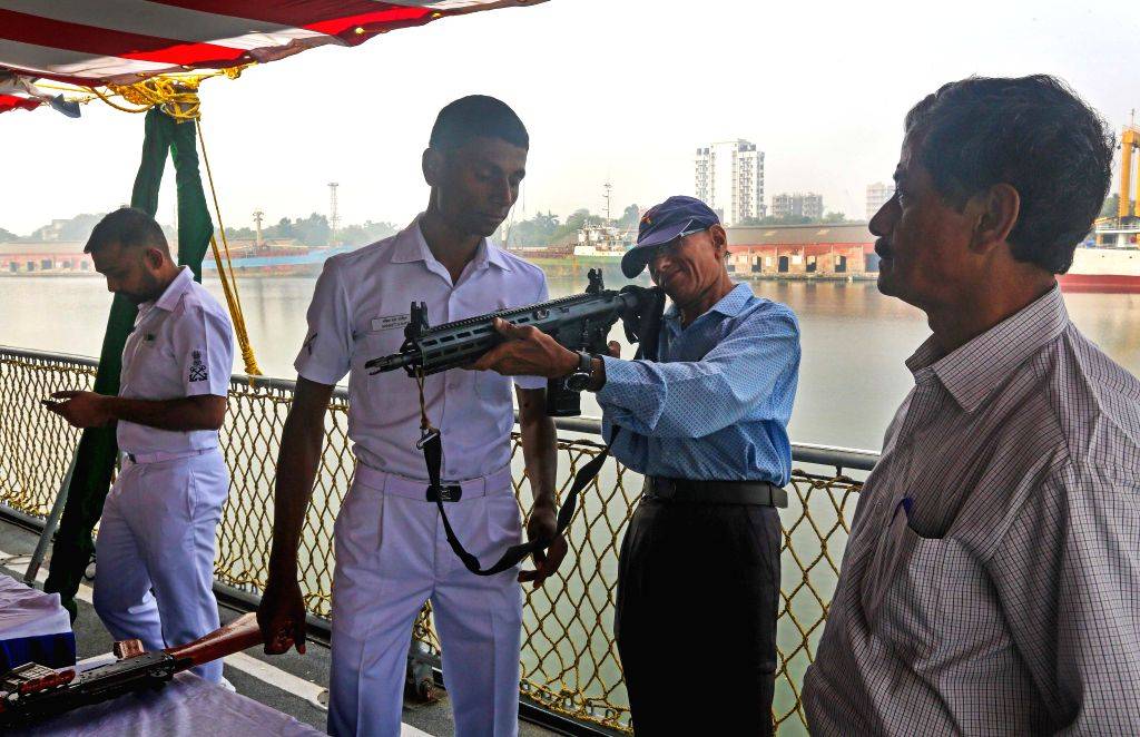 People visit INS Savitri during Navy Day celebrations at Kidderpore Dock