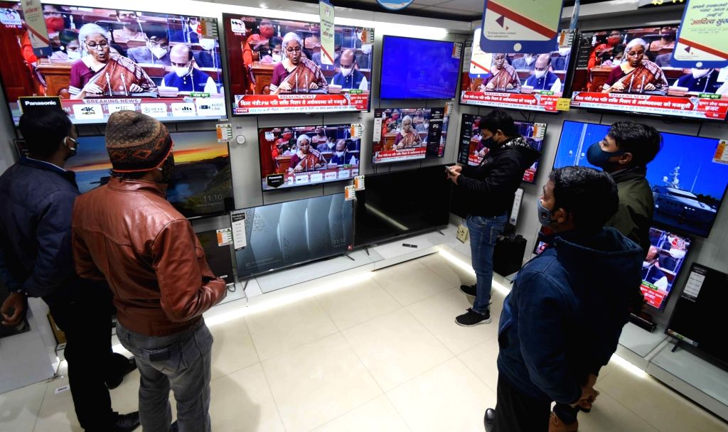 People watch the live telecast of the Union Budget 2022
