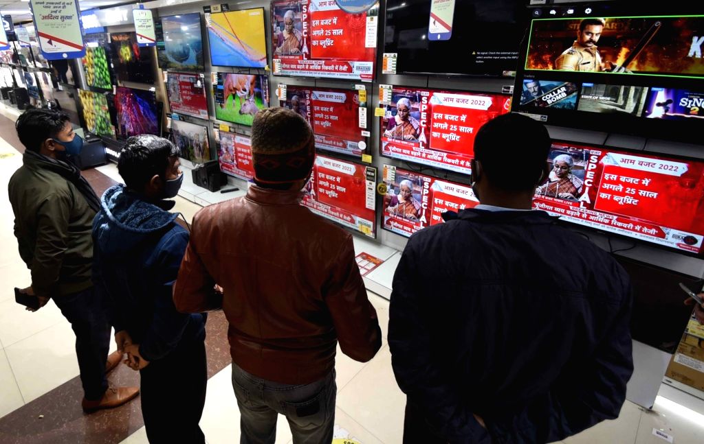 People watch the live telecast of the Union Budget 2022