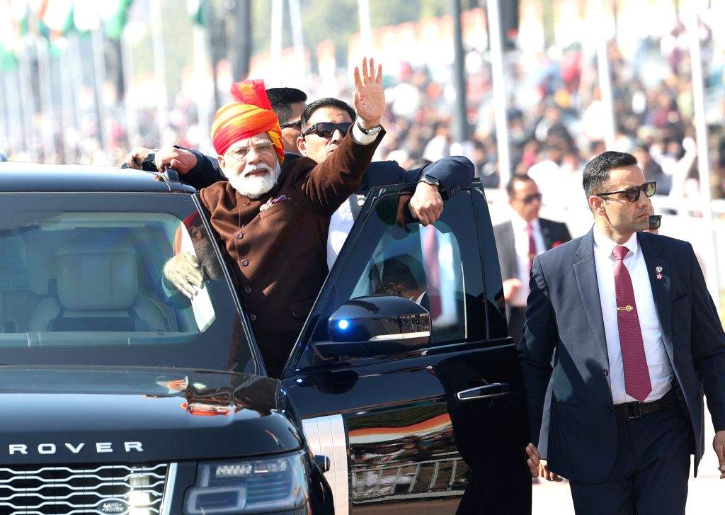 PM Narendra Modi greets the gathering as he leaves after attending the ...