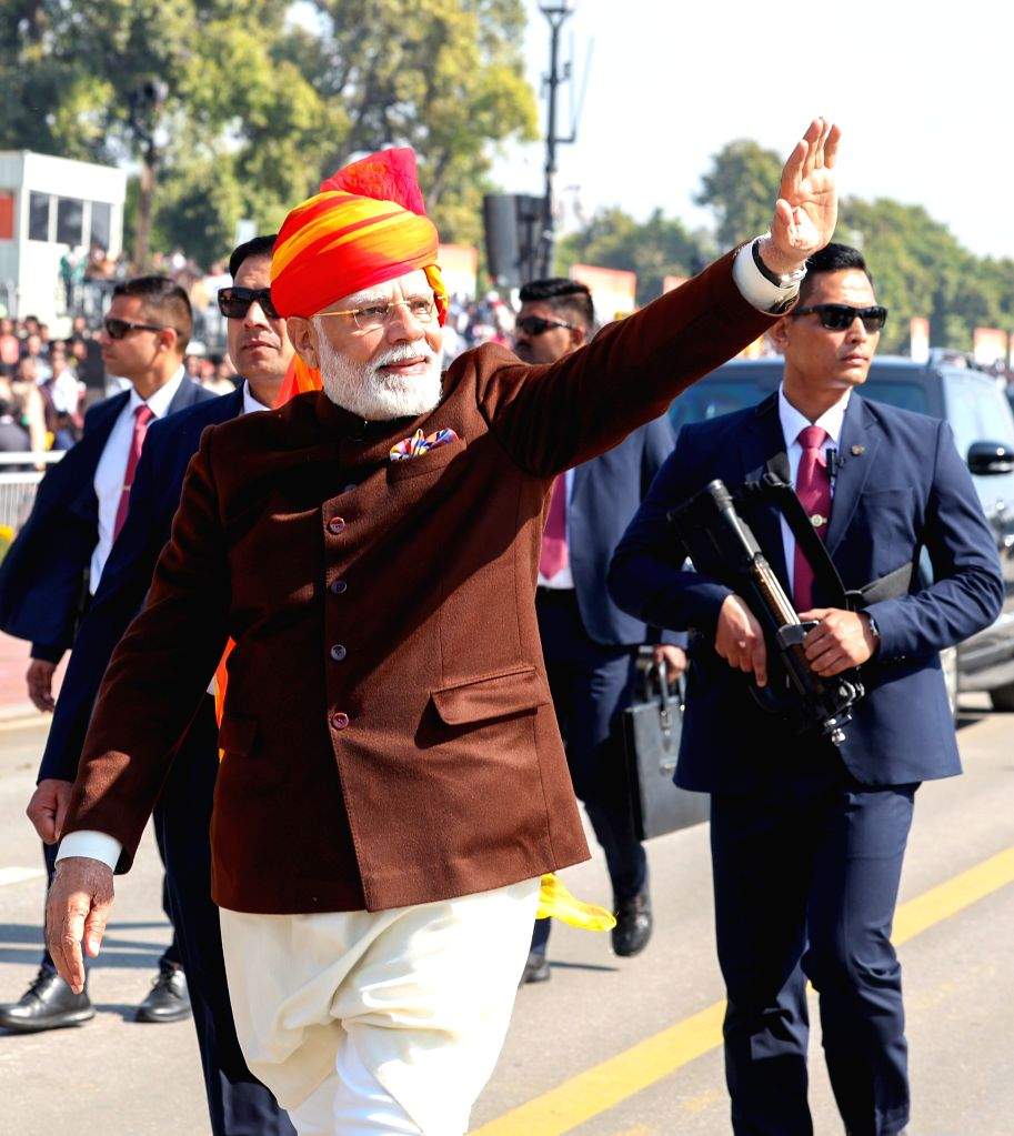 PM Narendra Modi greets the gathering as he leaves after attending the ...