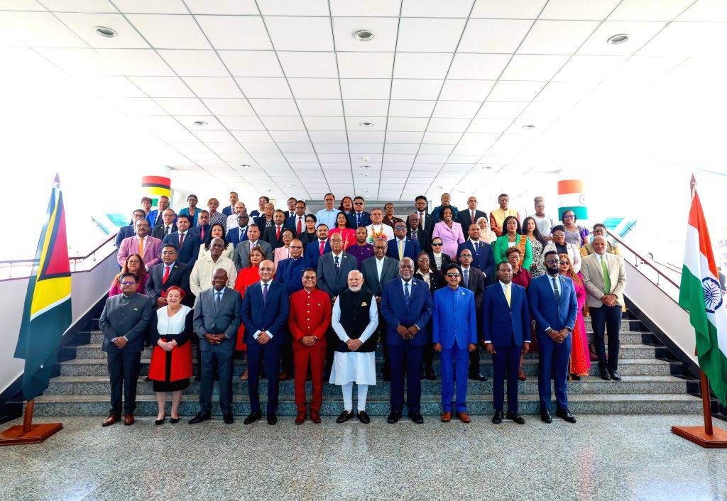 PM Narendra Modi poses for a group photograph with MPs and officials ...