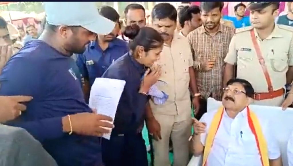 Free photo : Police job aspirants breakdown, fall on Home Min's feet ...