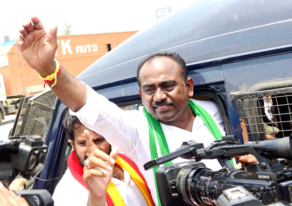 Police personnel detain Magadi JD(S) MLA A Manjunath