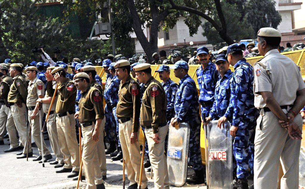 Police personnel stand guard outside AAP headquarters