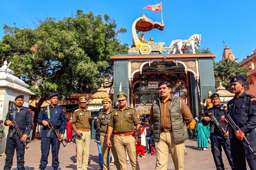 Police personnel stand guard outside the Sri Krishna Janmabhoomi temple