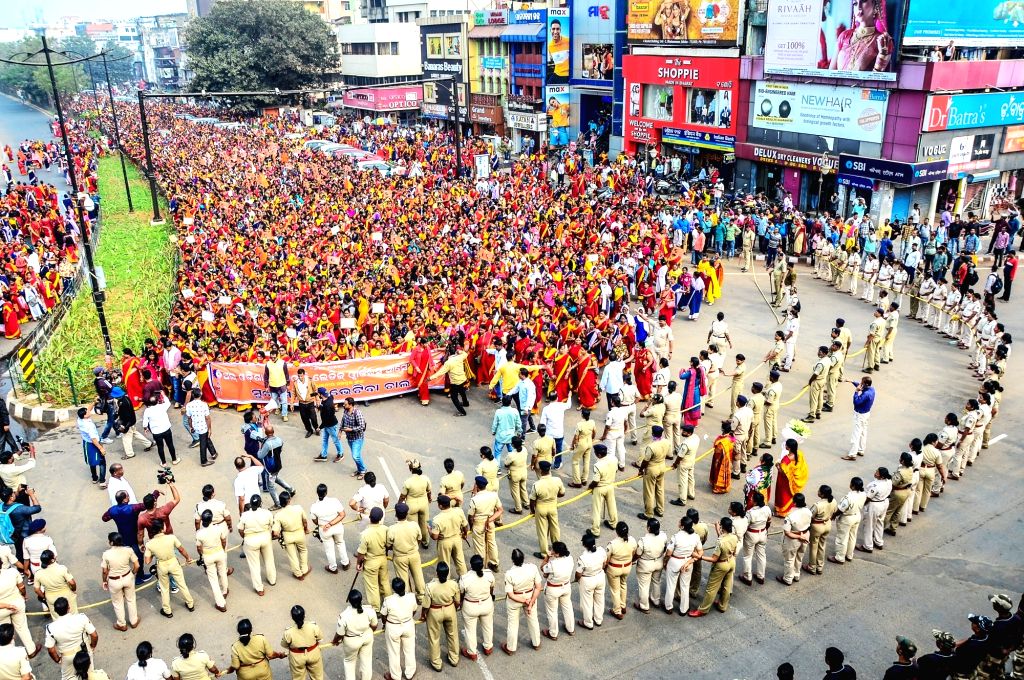 Police personnel try to stop Anganwadi workers as they take out a mass ...