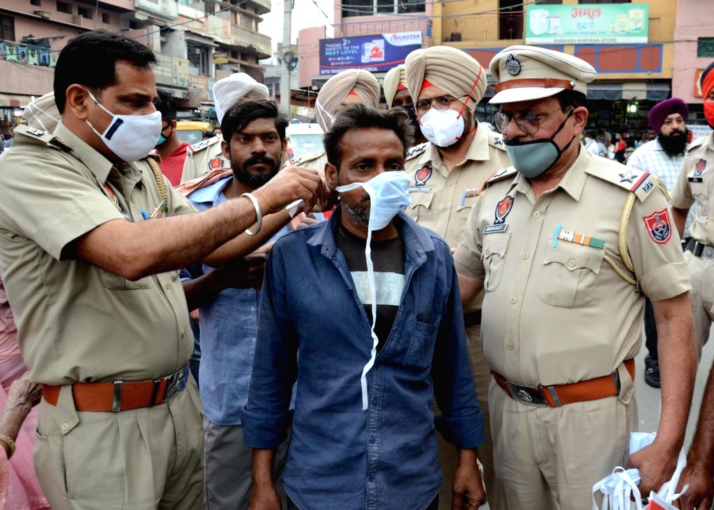 : Police personnels during an awareness campaign against the spread of ...
