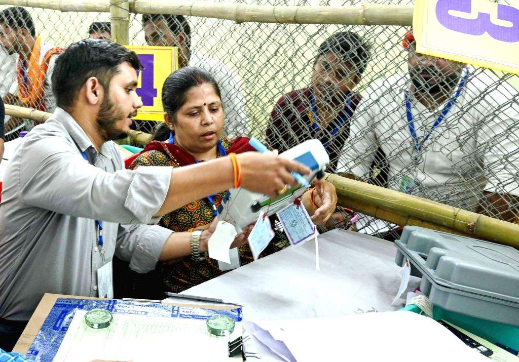 Polling officials at a counting centre during counting of votes for Lok ...