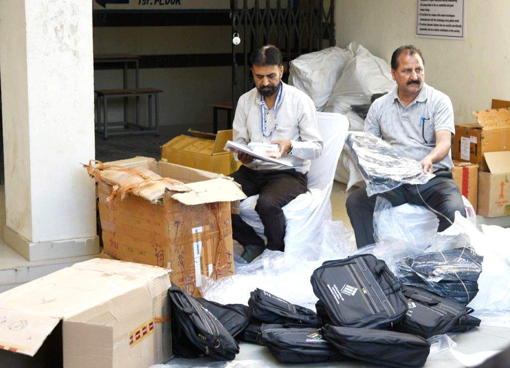 Polling officials checking the election related material for the 2nd ...