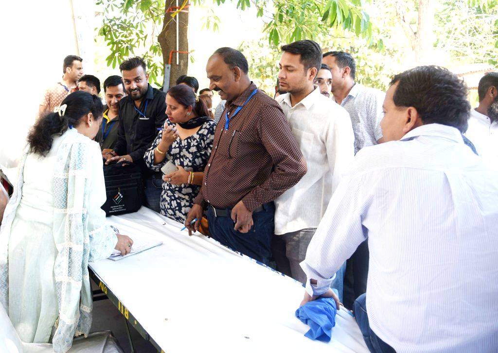 Polling officials checking the election related material for the 2nd ...