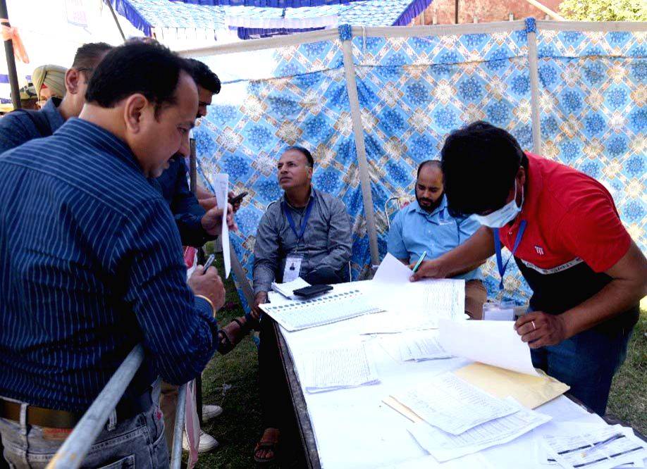 Polling officials checking the election related material for the 2nd ...