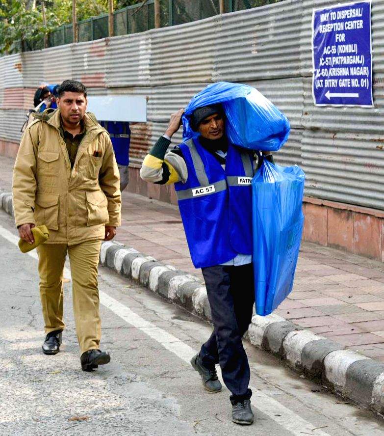 Polling Officials Collect Election Materials