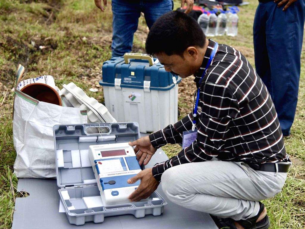 Polling officials collect EVMs and other election material at a ...