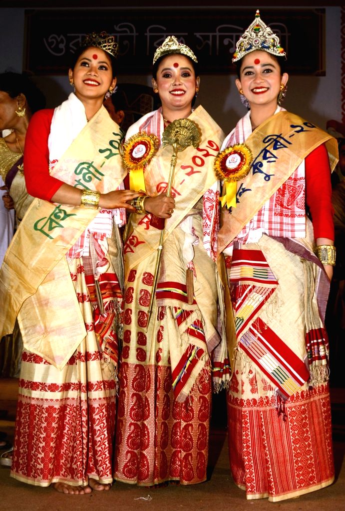 Pratiksharani Borgohain, centre, winner of Bihu Samragi poses during an ...
