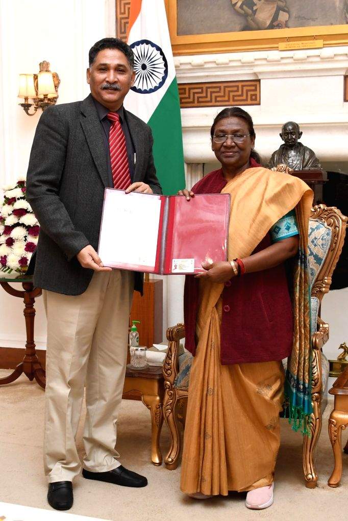 President Droupadi Murmu receives her Voter ID card from P ...