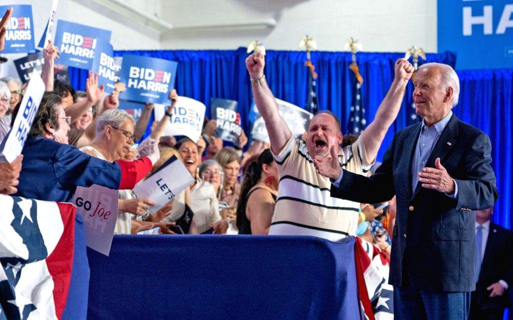 President of the United States Joe Biden gestures to the crowd as he ...