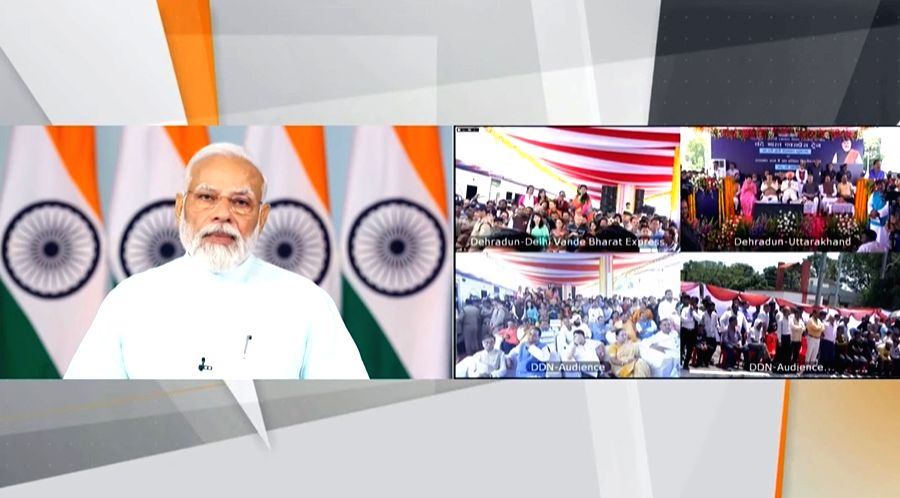 : Prime Minister Narendra Modi addresses during the flag-off ceremony ...