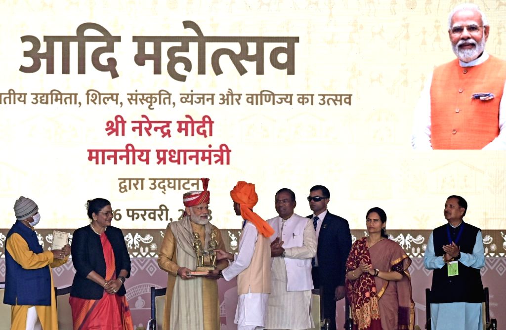 PM Modi being felicitated during theNational Aadi Mahotsav 2023