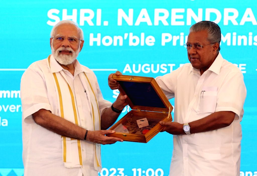 Prime Minister Narendra Modi being presented a memento by Chief ...